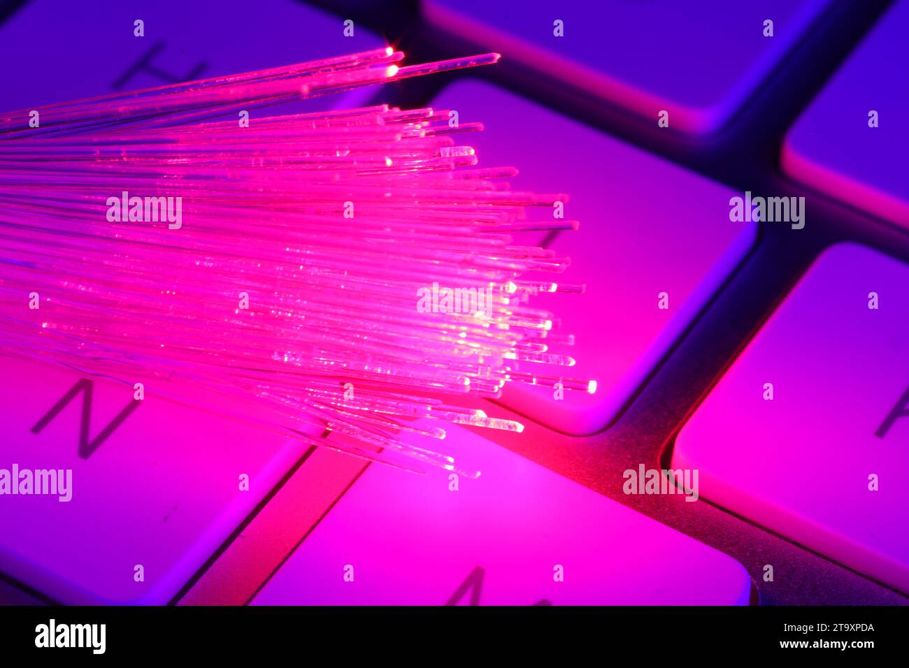 Optical fiber strands transmitting color light on computer keyboard ...