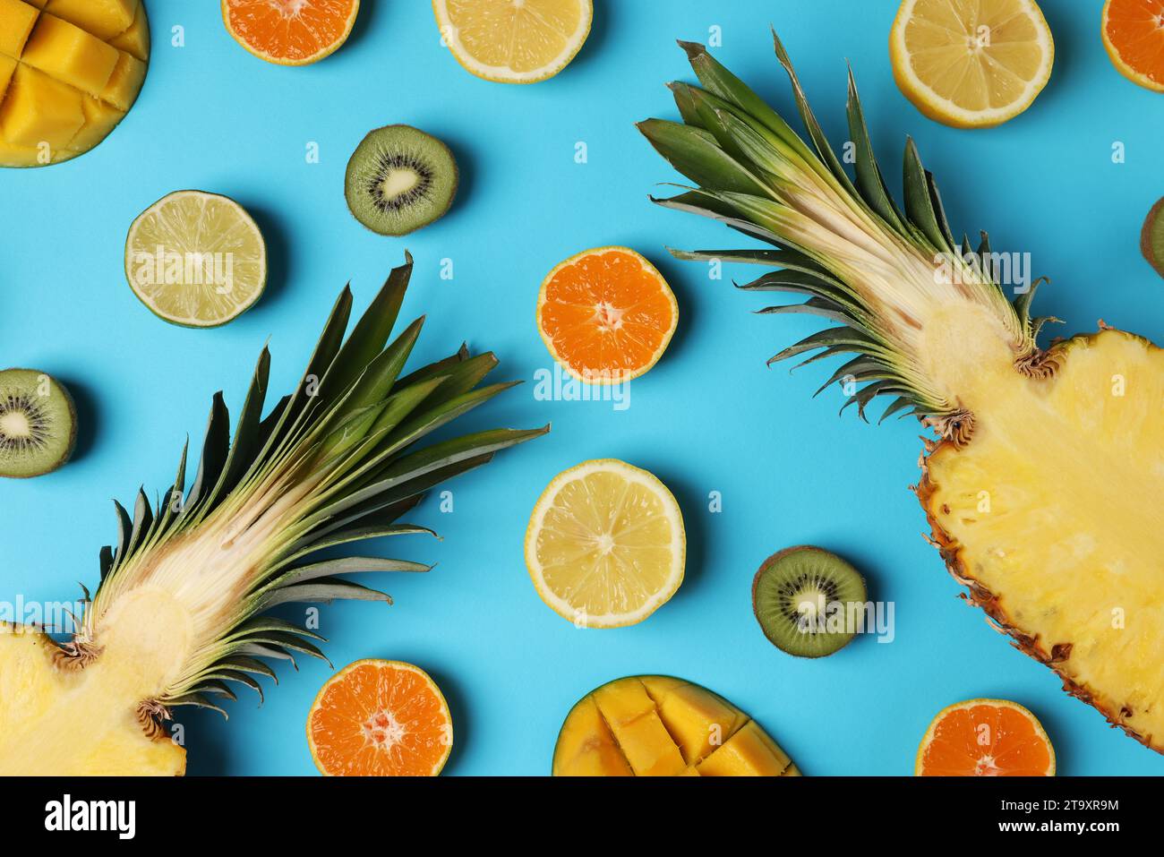 Different ripe fruits on light blue background, flat lay Stock Photo ...