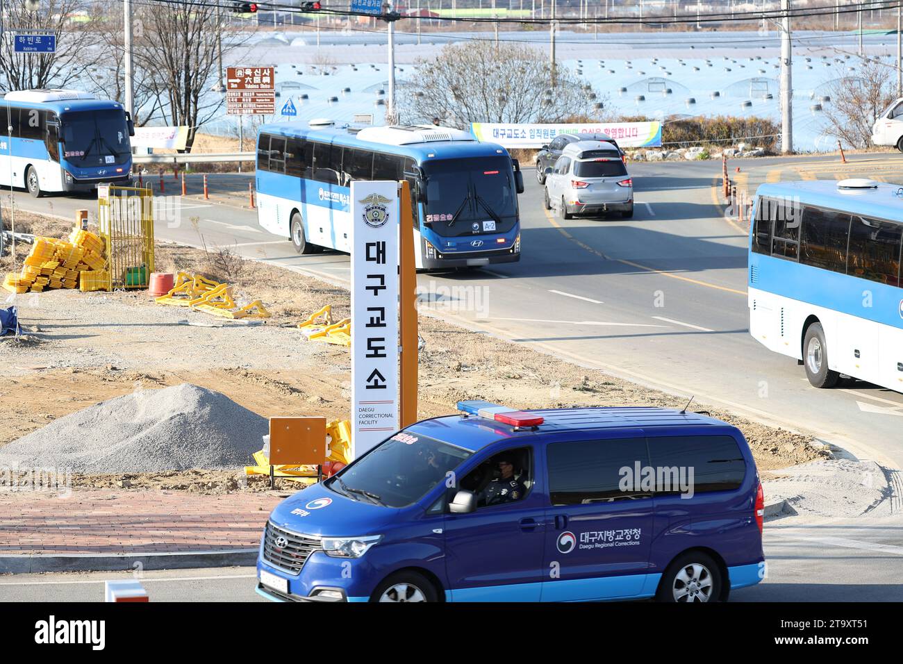 28th Nov, 2023. Inmate transfer Buses carrying inmates enter a newly ...