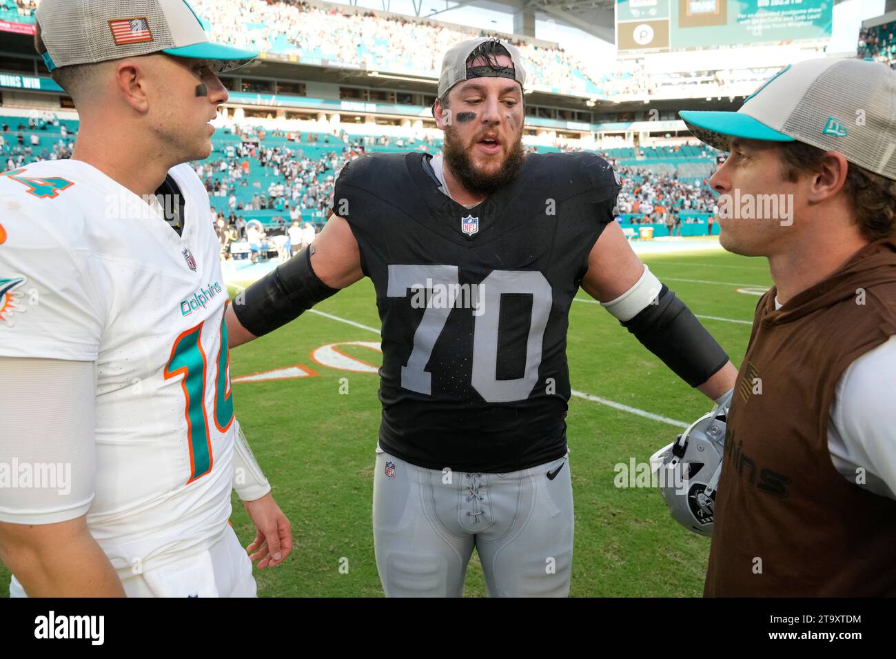 Miami Dolphins quarterback Mike White (14) and wide receiver Braxton ...