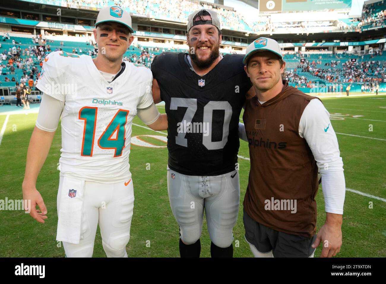 Miami Dolphins quarterback Mike White (14) and wide receiver Braxton ...