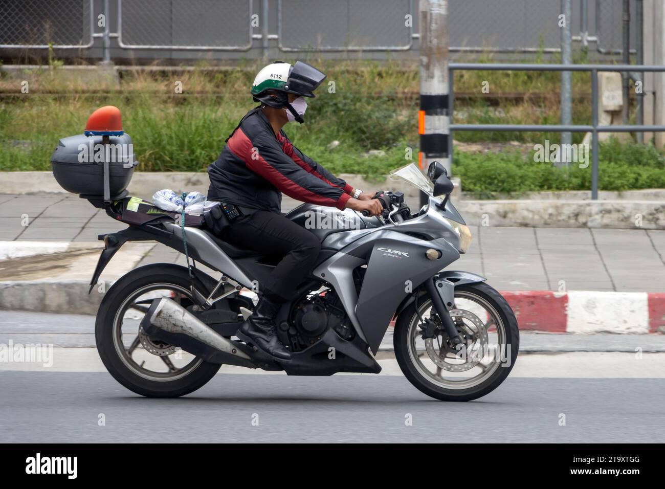 BANGKOK, THAILAND, SEP 30 2023, A policeman rides a motorcycle on the ...