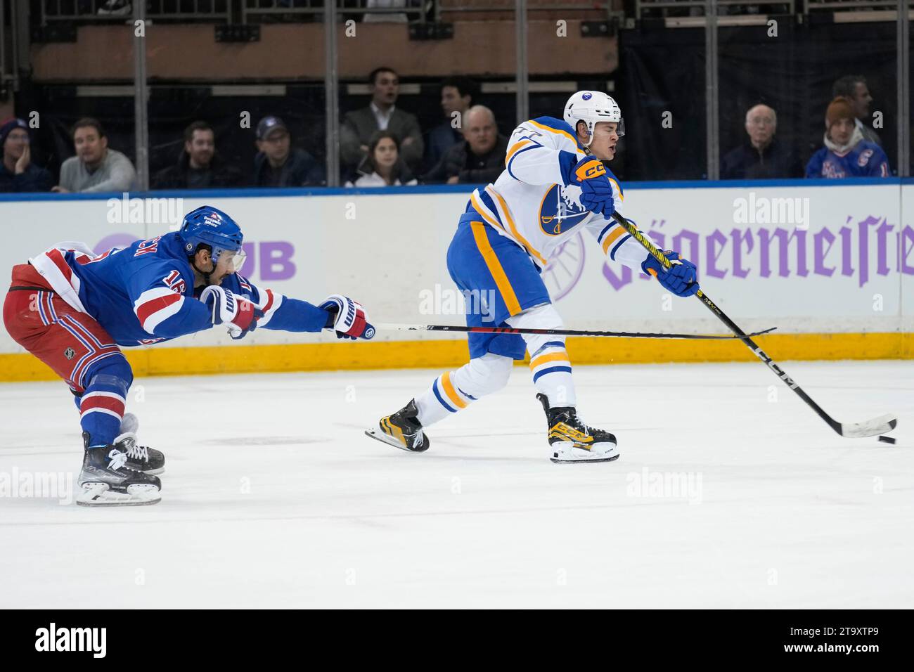 Buffalo Sabres' JJ Peterka, right, shoots while New York Rangers' Vincent Trocheck pursues ...