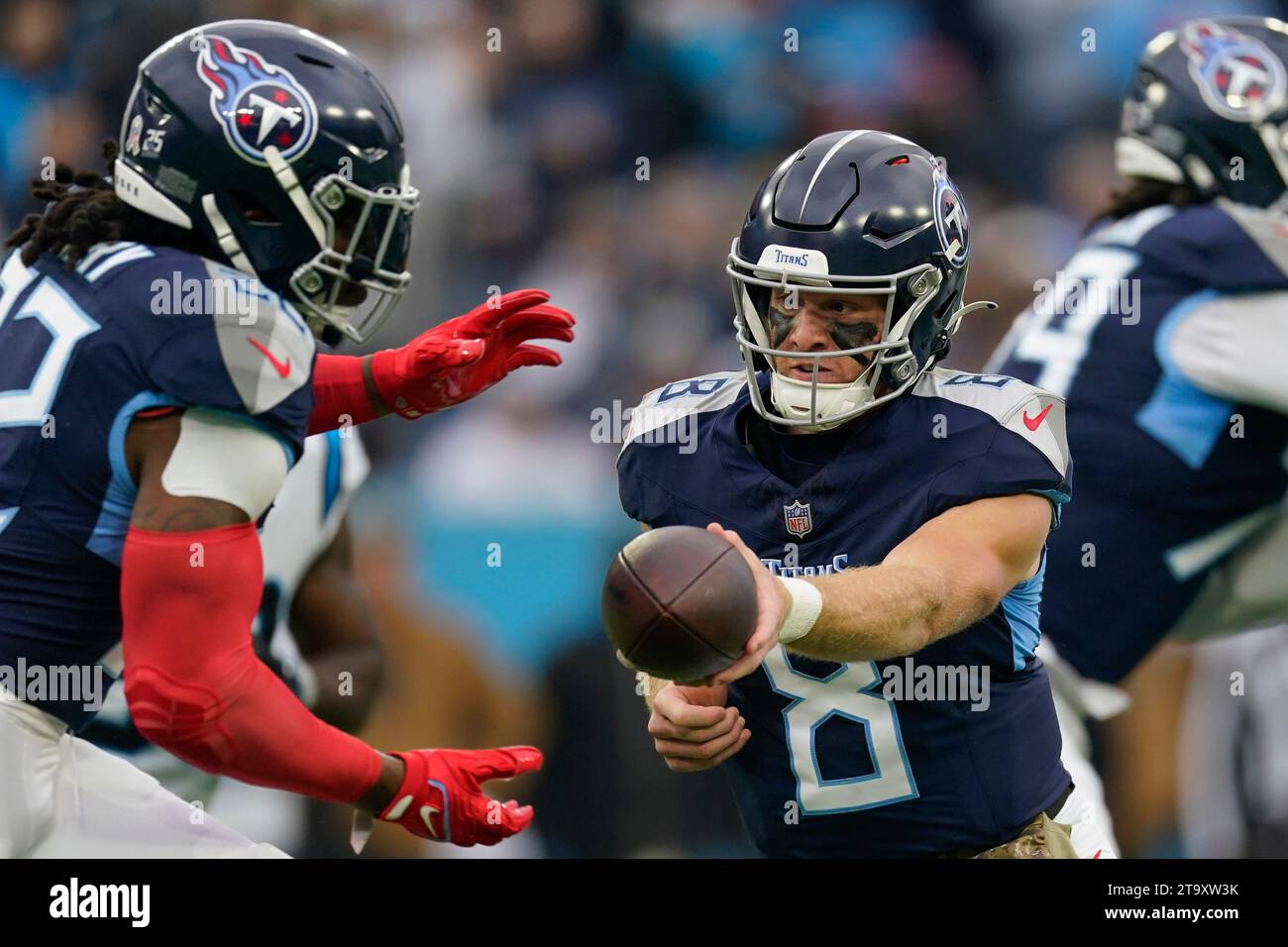 Tennessee Titans quarterback Will Levis (8) hands the ball off to ...