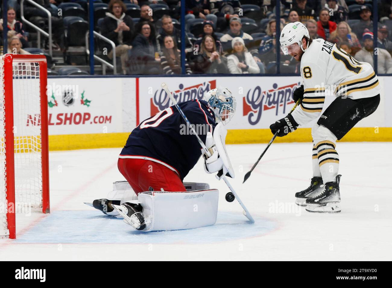Columbus Blue Jackets' Spencer Martin, left, makes a save against ...