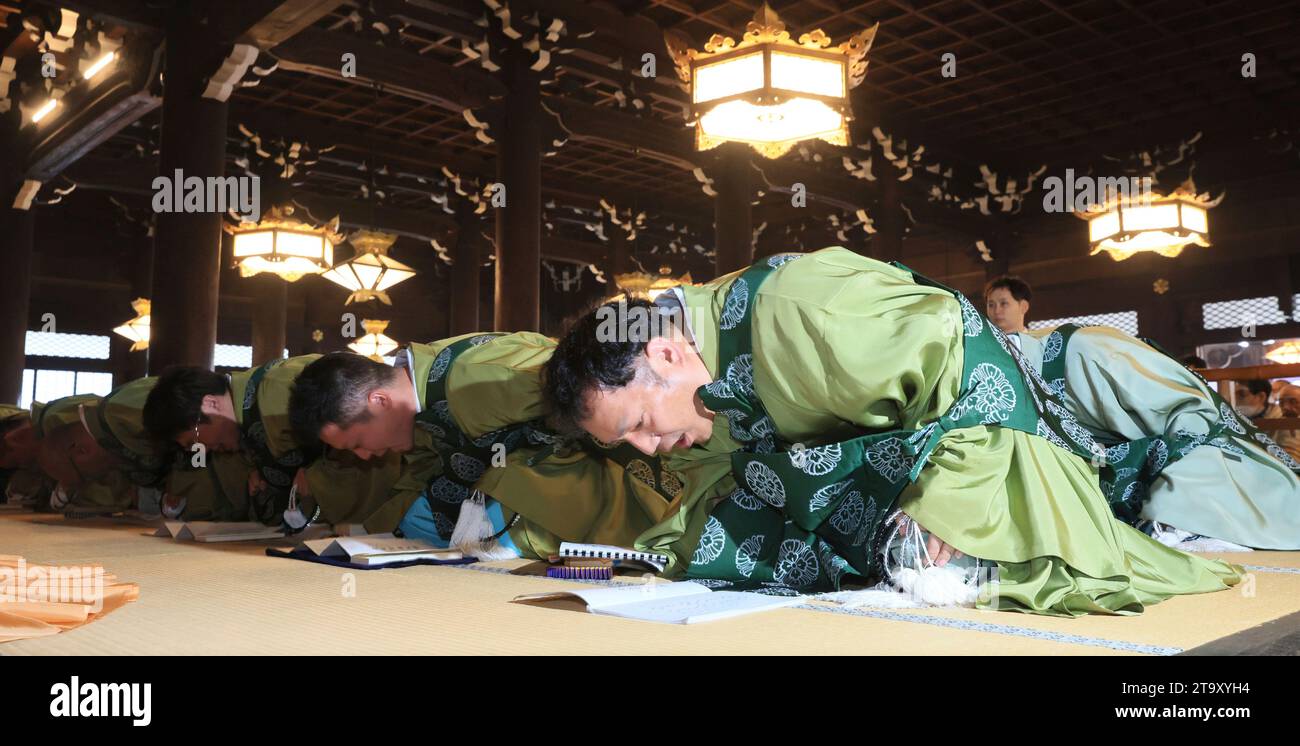 Japanese monks moving their bodies in all directions chant a Buddhist ...