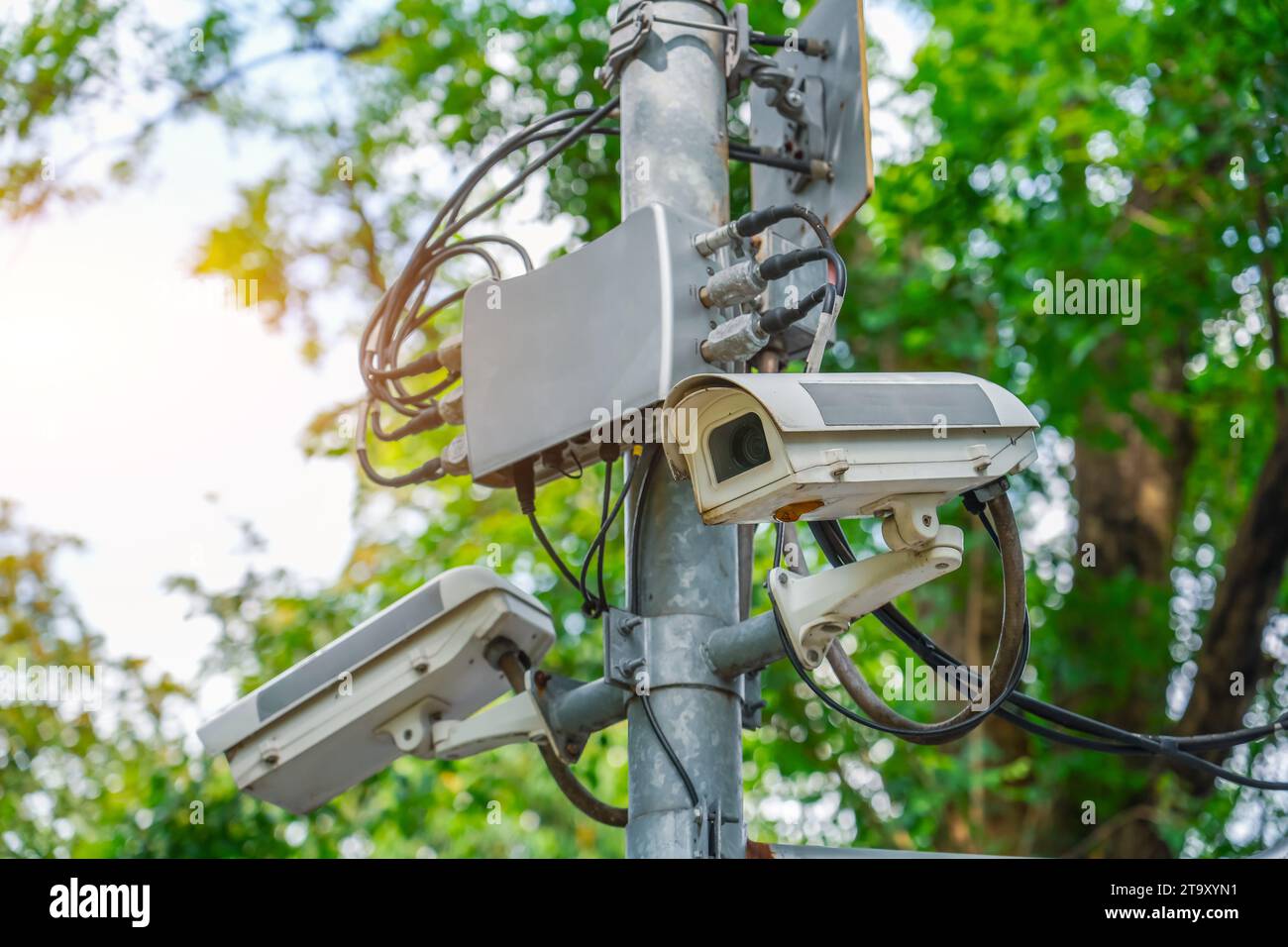 CCTV cameras on metal pole in public park for monitor, observe and ...