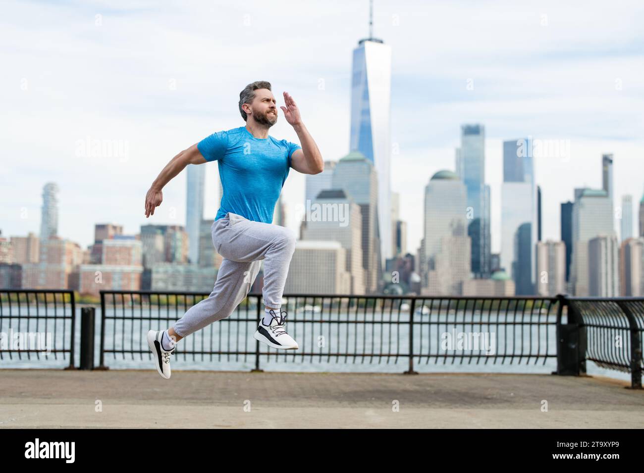 Runner. Running man jogging outside in street. Mature man runner and ...