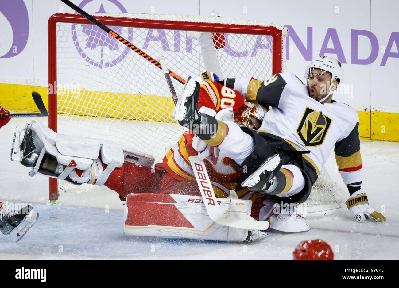 Vegas Golden Knights forward William Carrier, right, slams into Calgary ...