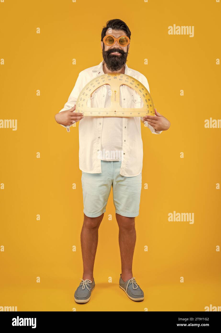cheerful man with geometry protractor on background. photo of man with ...