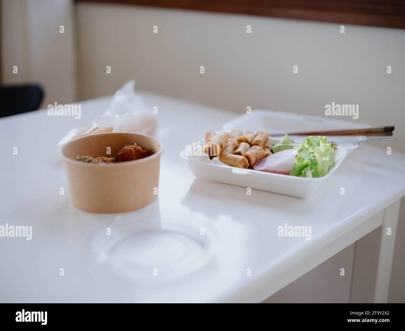 Food from delivery on the table in plastic utensils, a fast food ...