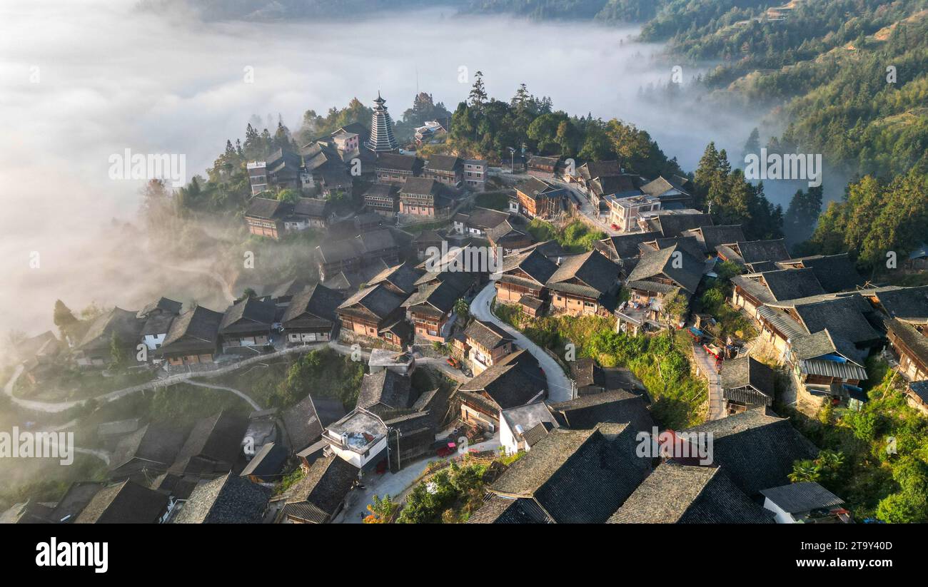 QIANDONGNAN, CHINA - NOVEMBER 28, 2023 - Jianhua Village surrounded by ...