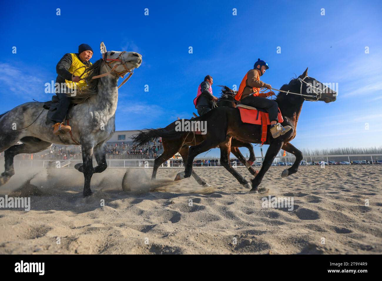 Riders compete in a winter horse racing in Bohu County, Bayingolin ...