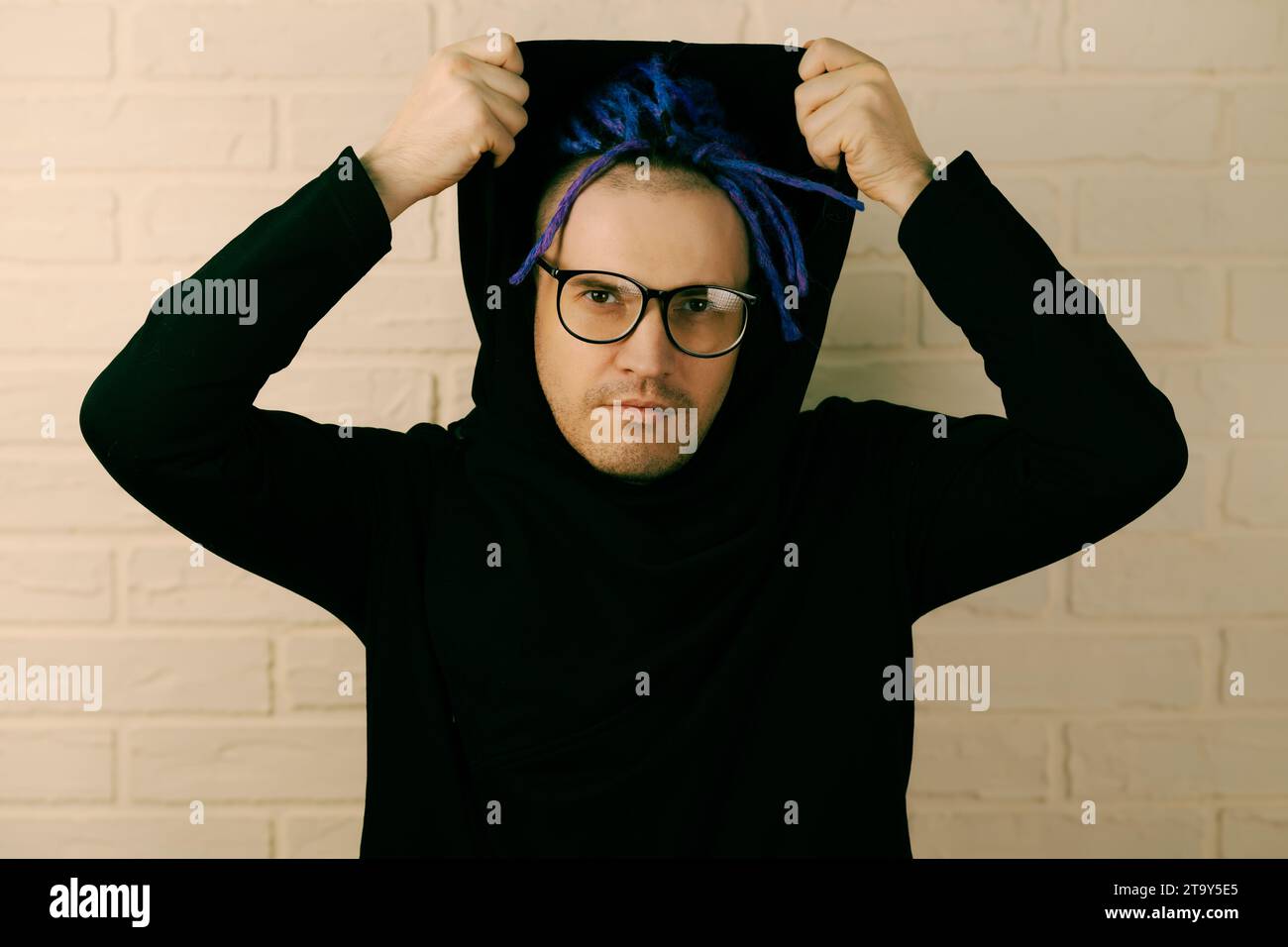 The Vibrant Man with Striking Purple Dreadlocks and Unique Style, puts ...