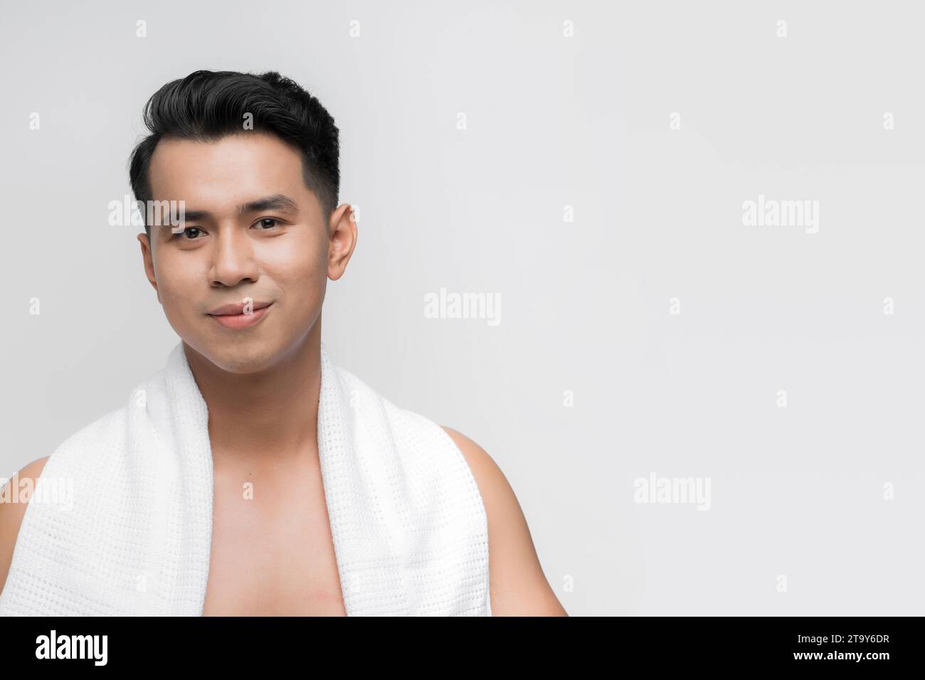 Young man towel over shoulders hi-res stock photography and images - Alamy