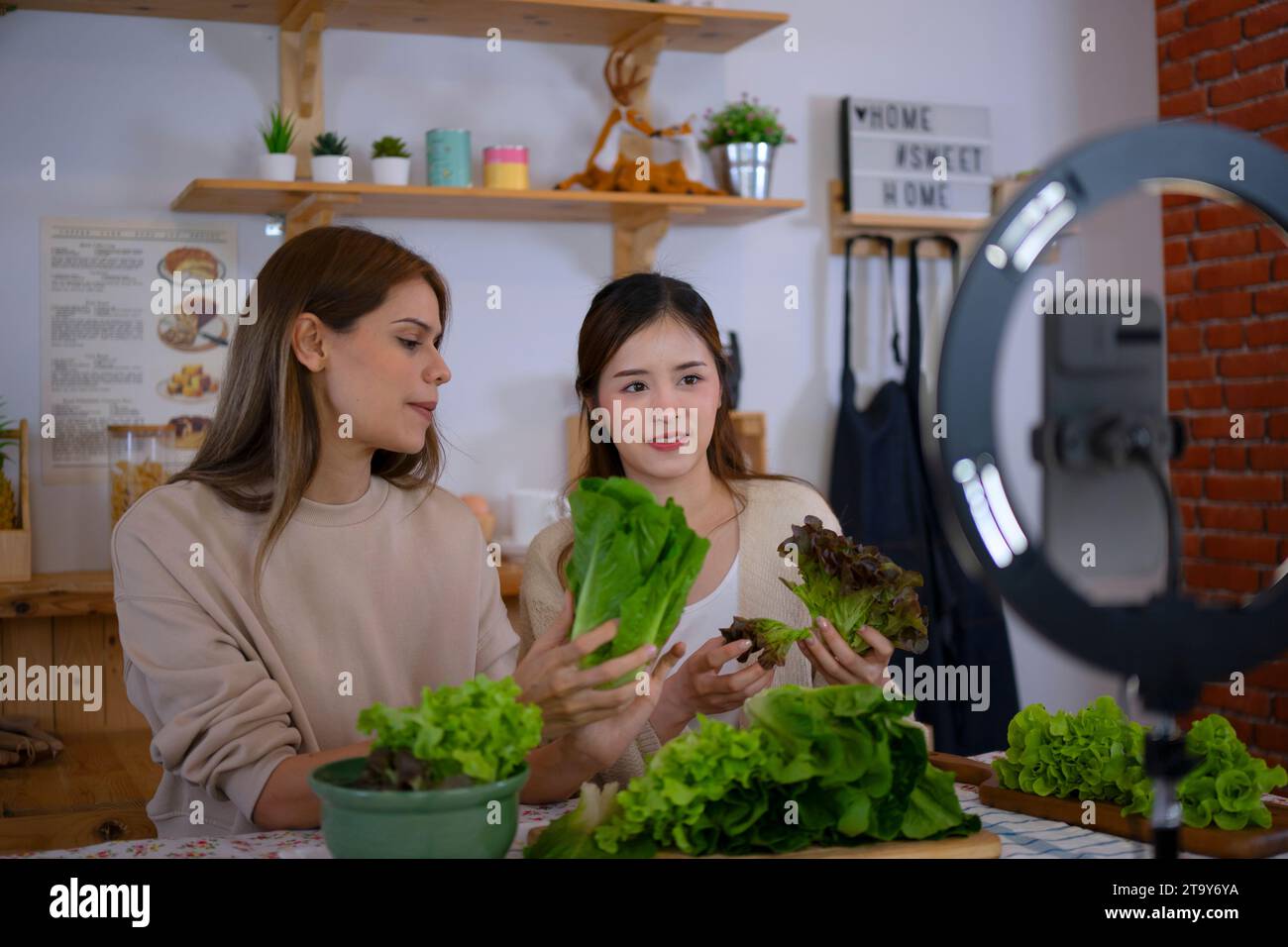 Pretty woman is livestreaming for sell healthy food. Vlogging and ...