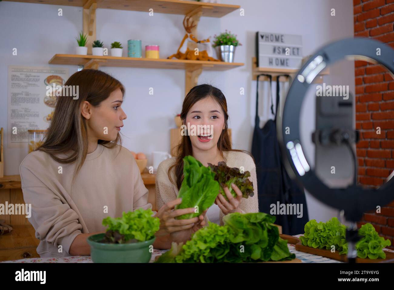 Pretty woman is livestreaming for sell healthy food. Vlogging and ...