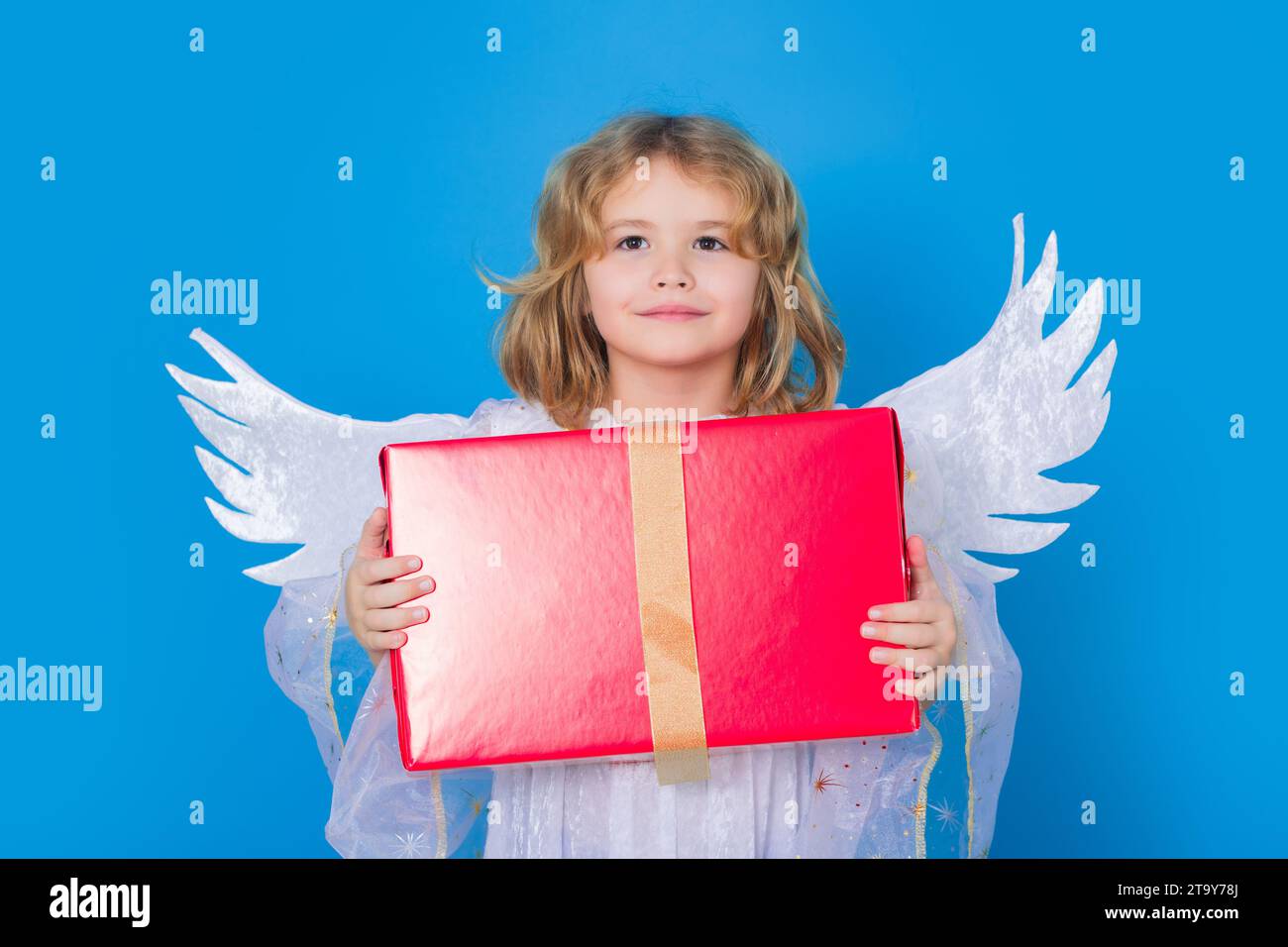 Kid boy angel with gift box present. Valentine's day. Blonde cute child ...
