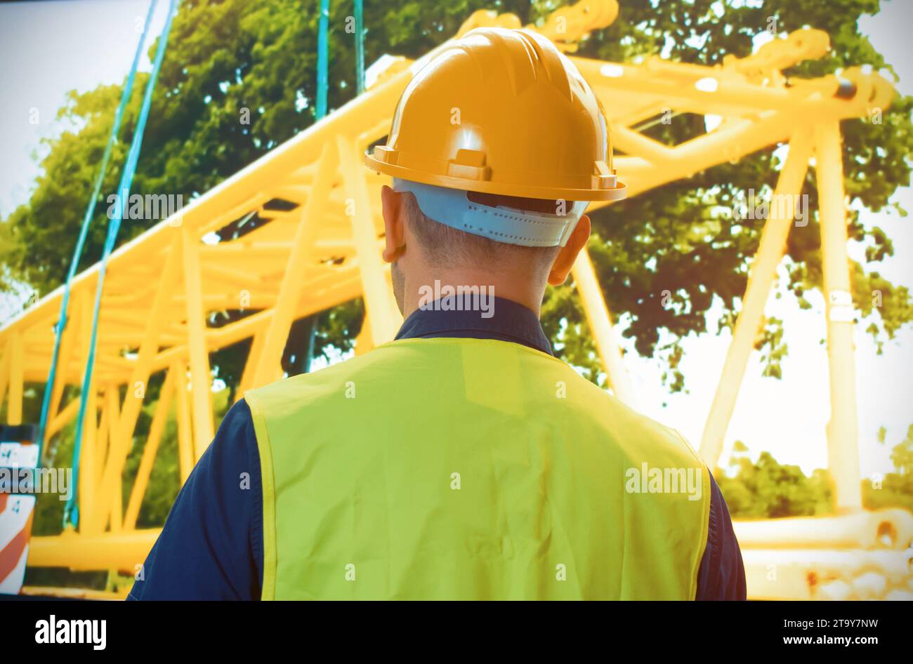 Back view of Male construction worker against building construction ...