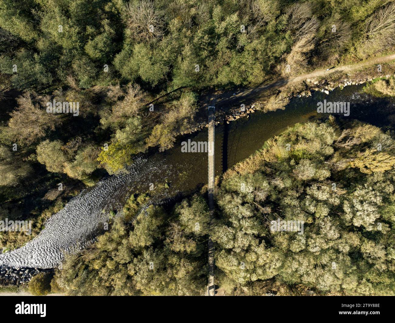 Aerial view of the simple suspension bridge walkway over the Segre ...