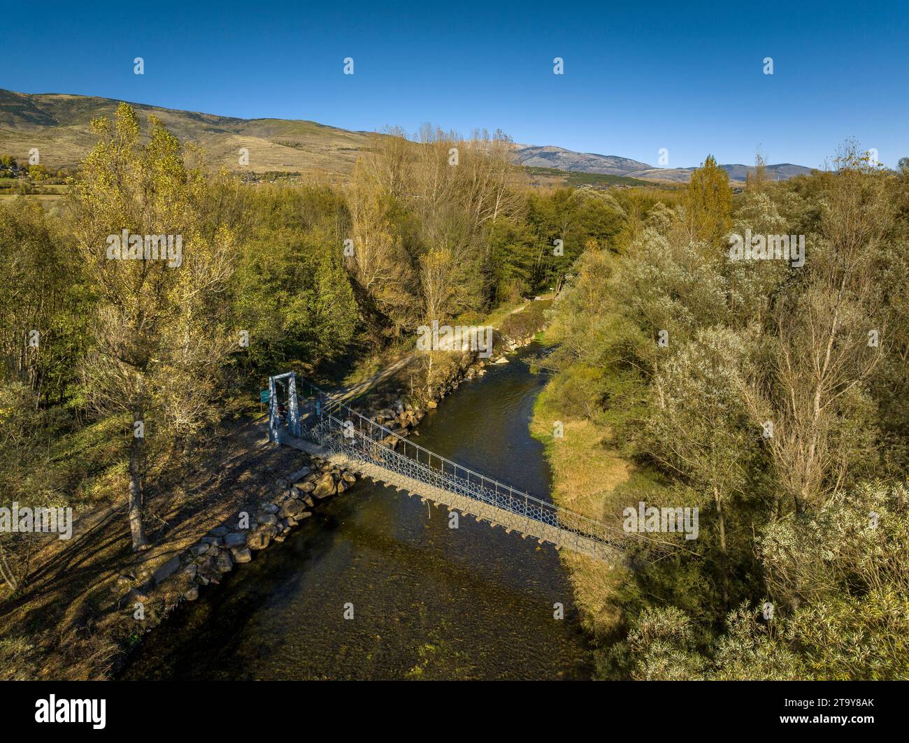 Aerial view of the simple suspension bridge walkway over the Segre ...
