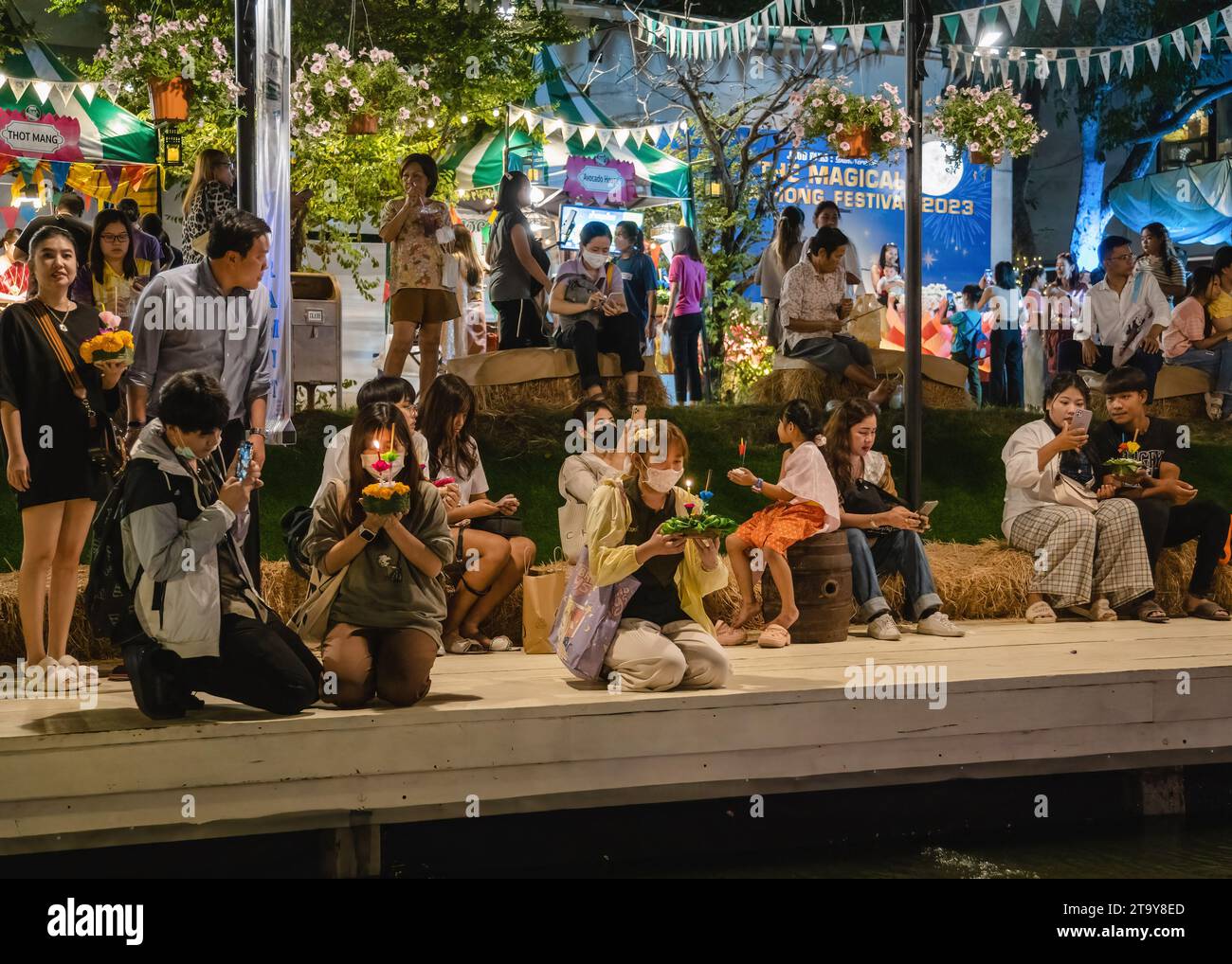 Thai and foreigners are seen praying in front of their krathong before ...