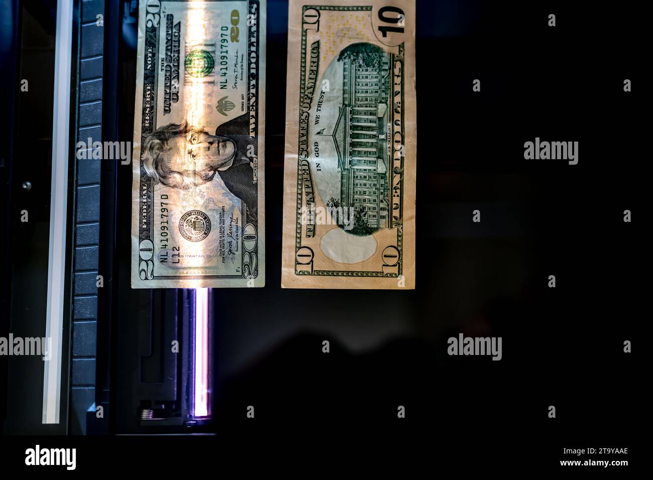 Using a copy machine to print forgery currency Stock Photo - Alamy