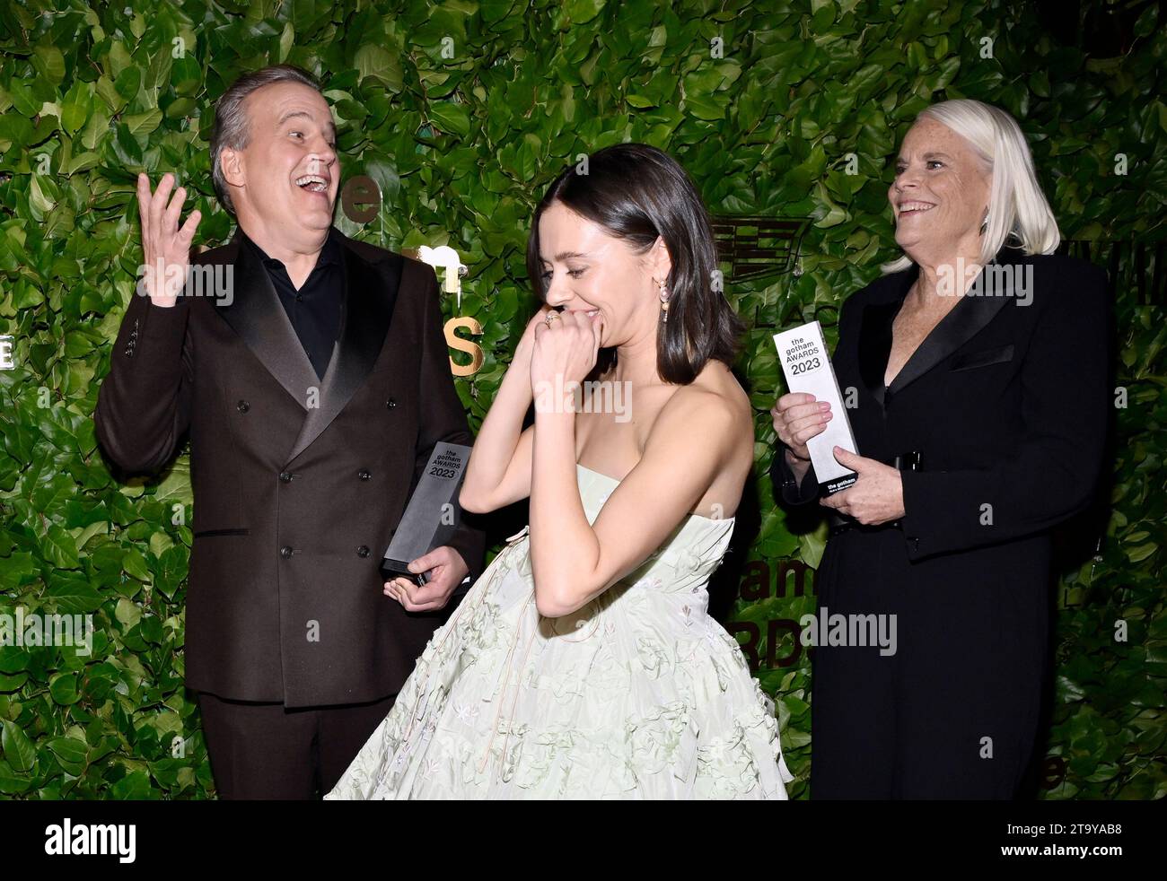 Tony Phelan, left, Bel Powley and Joan Rater pose with the award for ...