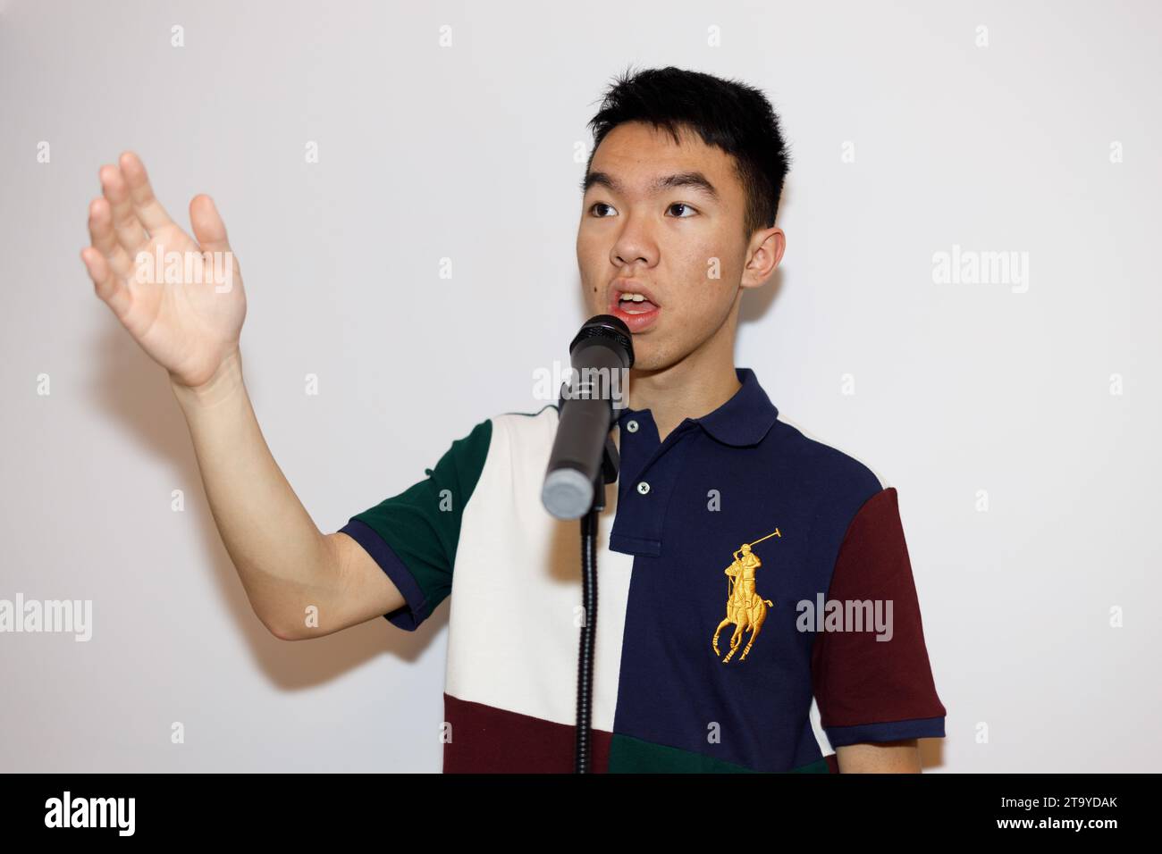 Boy gesturing while giving speech at Chinese speech contest, Lau, Chun ...