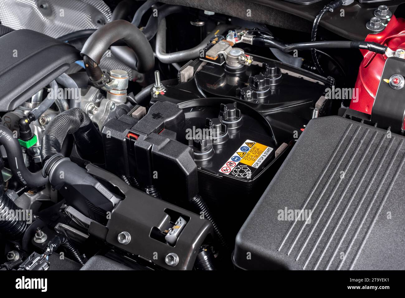 New car battery in the clean engine room. Car maintenance concept Stock ...