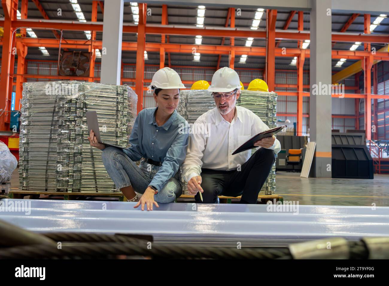 Metalwork manufacturing factory manager inspect newly manufactured ...