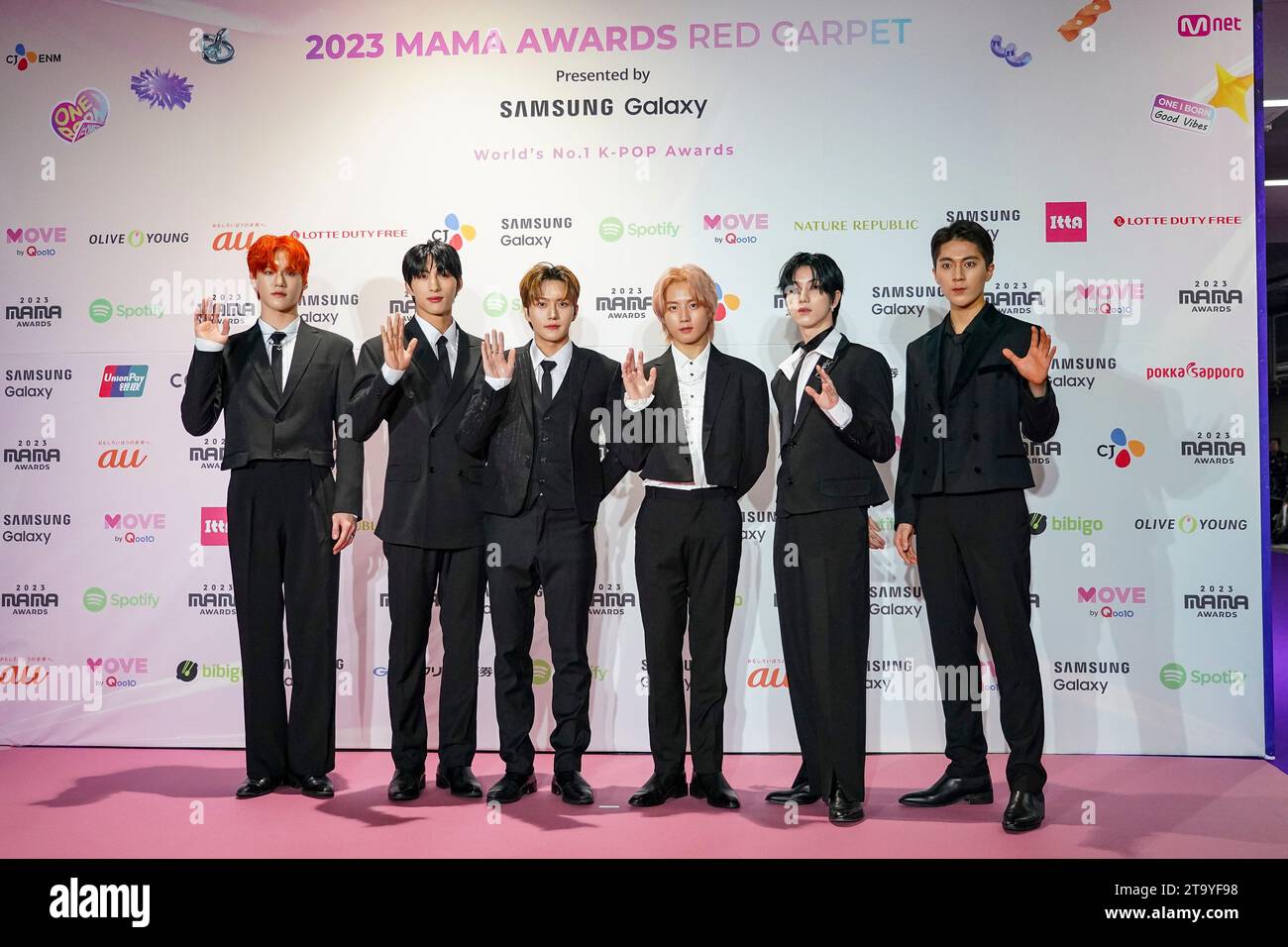 Members of the band Just B pose for photos on the red carpet of the 2023 MAMA Awards at Tokyo ...
