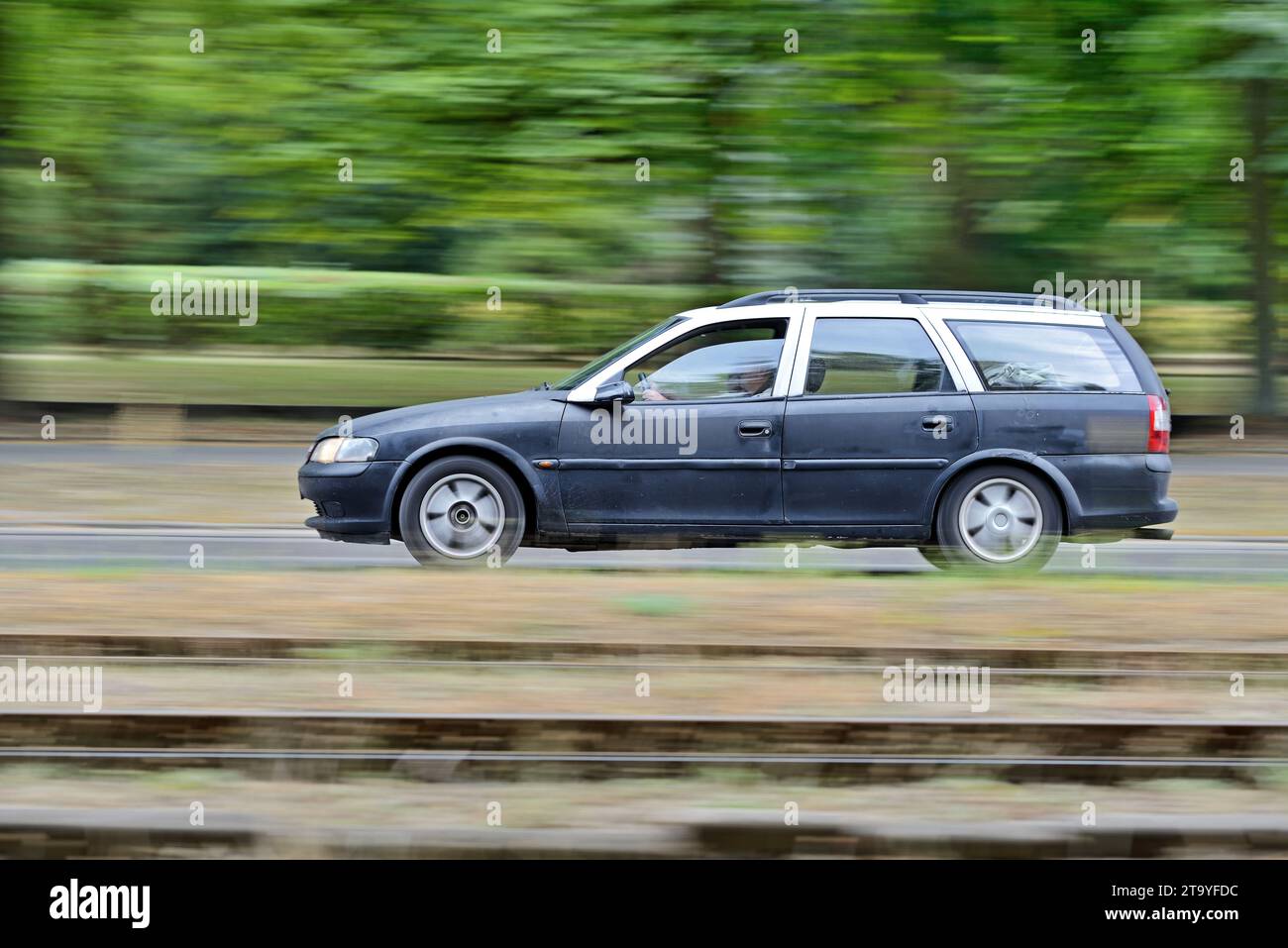 Road transport - car in motion Stock Photo - Alamy