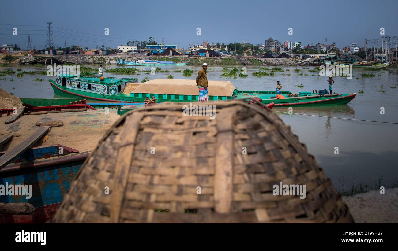 Traditional cargo boat station beside the riverbank. A picturesque ...