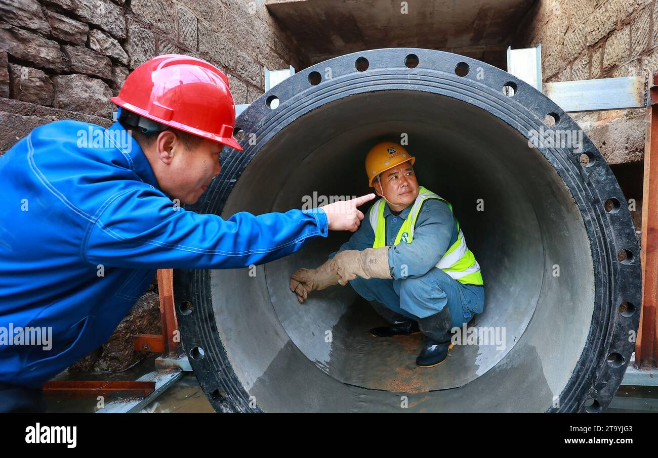 ZAOZHUANG, CHINA - NOVEMBER 23, 2023 - A staff member checks the ...