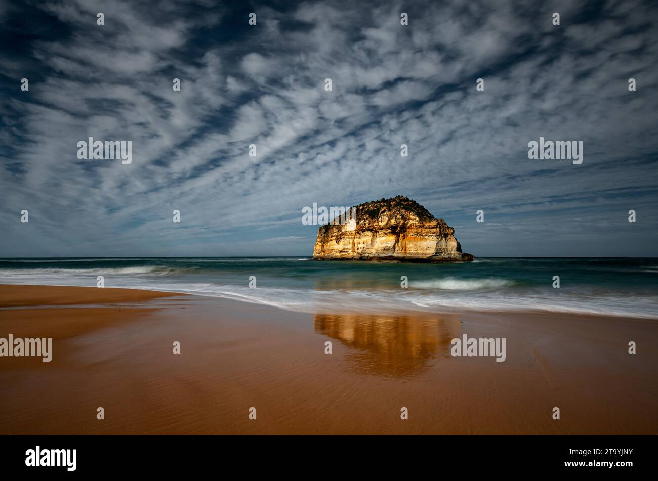 A lonely sea stack in Sandy Cove at the famous Great Ocean Road Stock ...