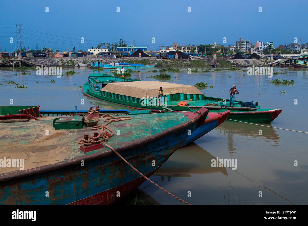 Traditional cargo boat station beside the riverbank. A picturesque ...