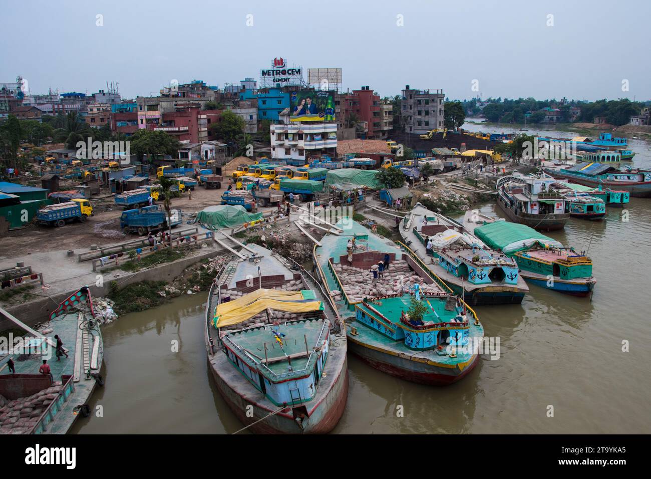 Traditional cargo boat station beside the riverbank. A picturesque ...