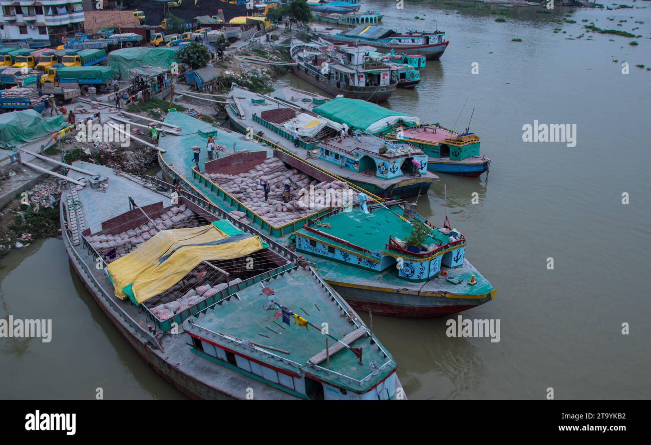Traditional cargo boat station beside the riverbank. A picturesque ...