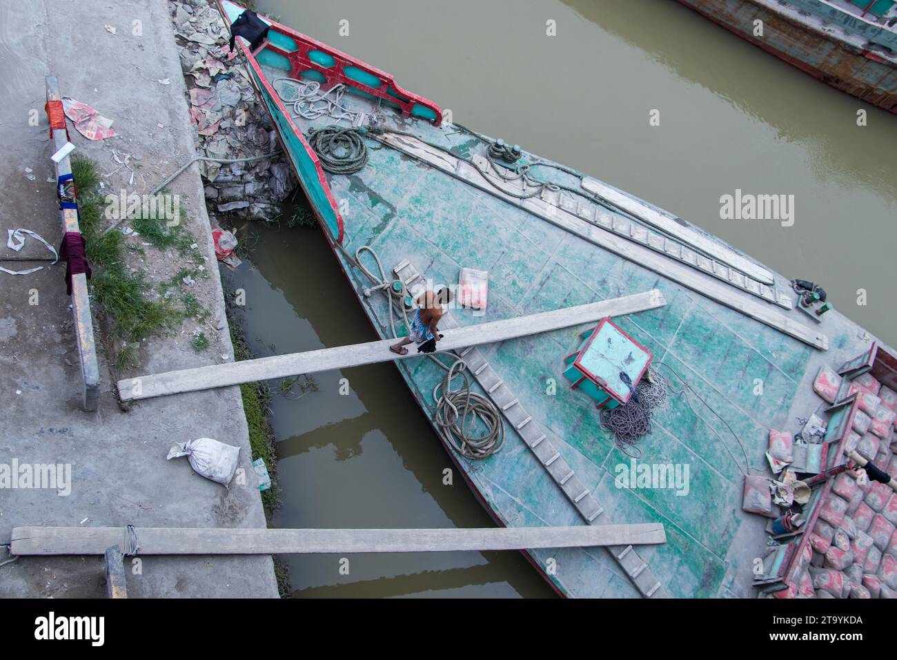 Traditional cargo boat station beside the riverbank. A picturesque ...