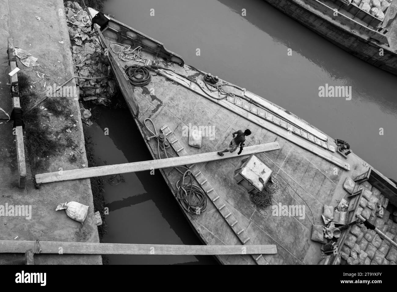 Traditional cargo boat station beside the riverbank. A picturesque ...