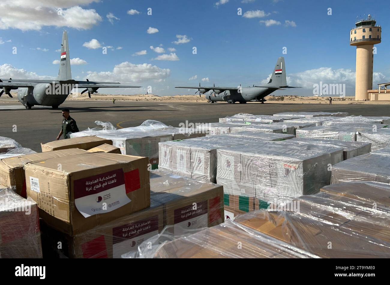 Al Arisch, Egypt. 27th Nov, 2023. Relief supplies stand in front of two ...