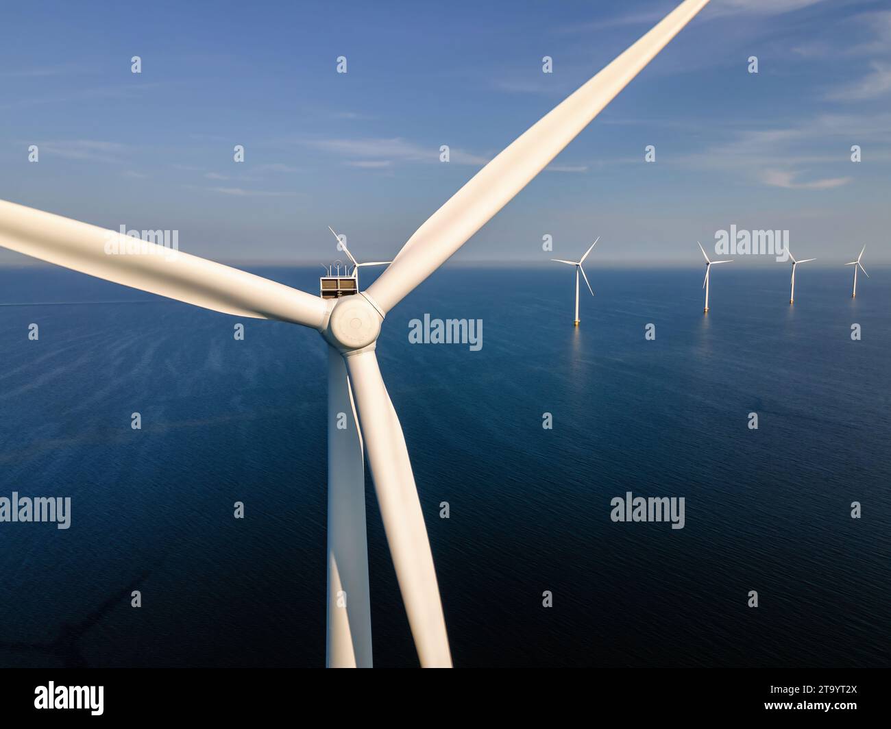 Wind turbine from an aerial view, windmill farm in the lake IJsselmeer ...
