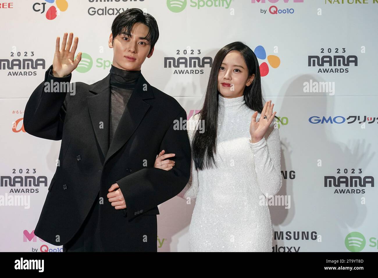Hwang Min-hyun, left, and Kim So-hyun pose for photos on the red carpet of the 2023 MAMA Awards ...