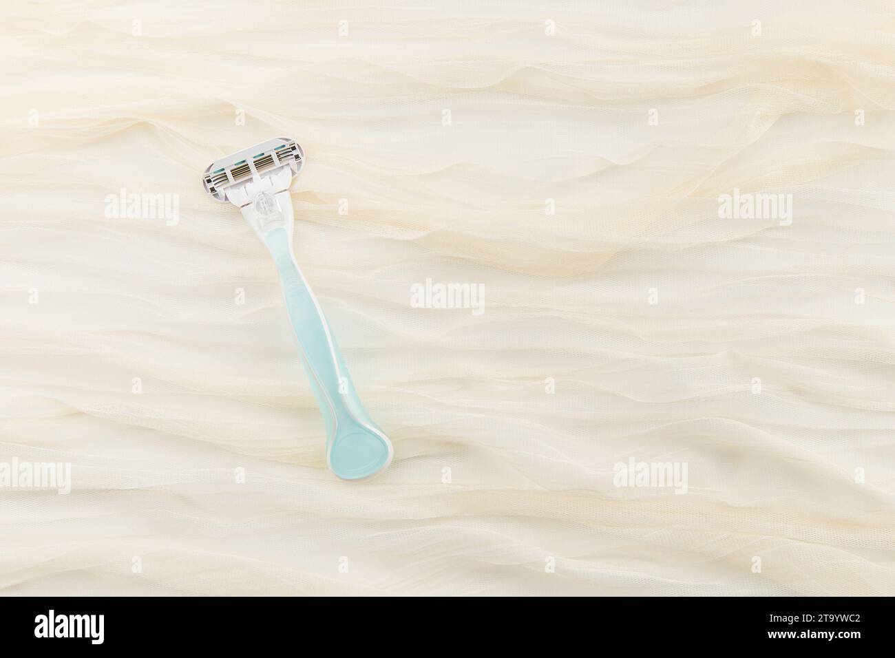 Razor on soft fabric. Tactile elegance, transforming your grooming ...