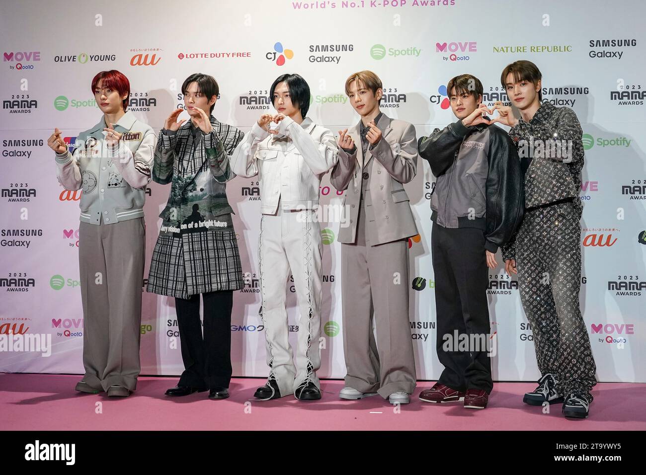 Members of Riize pose for photos on the red carpet of the 2023 MAMA Awards at Tokyo Dome Tuesday ...