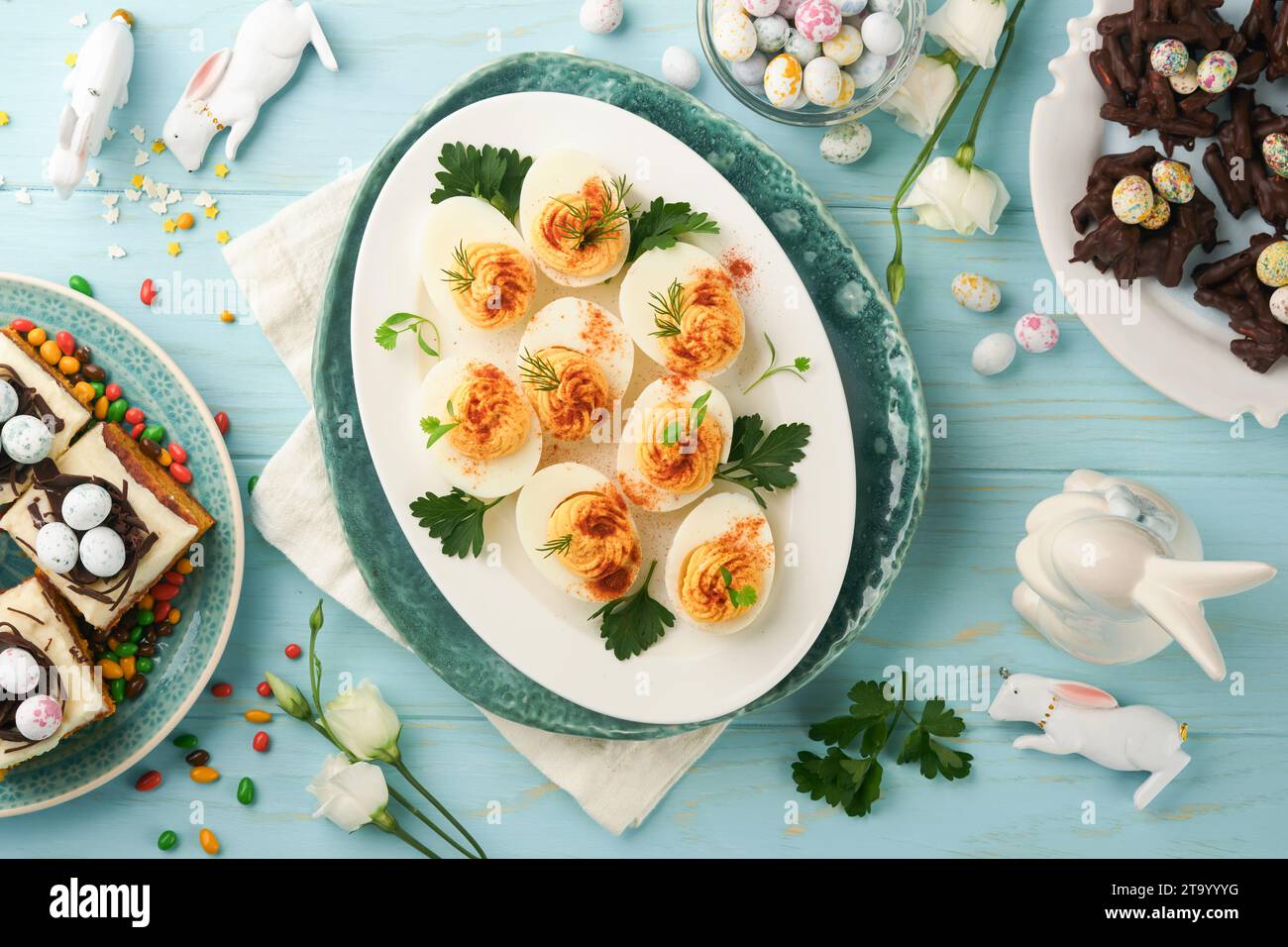 Traditional Easter brunch or dinner with stuffed eggs with paprika ...