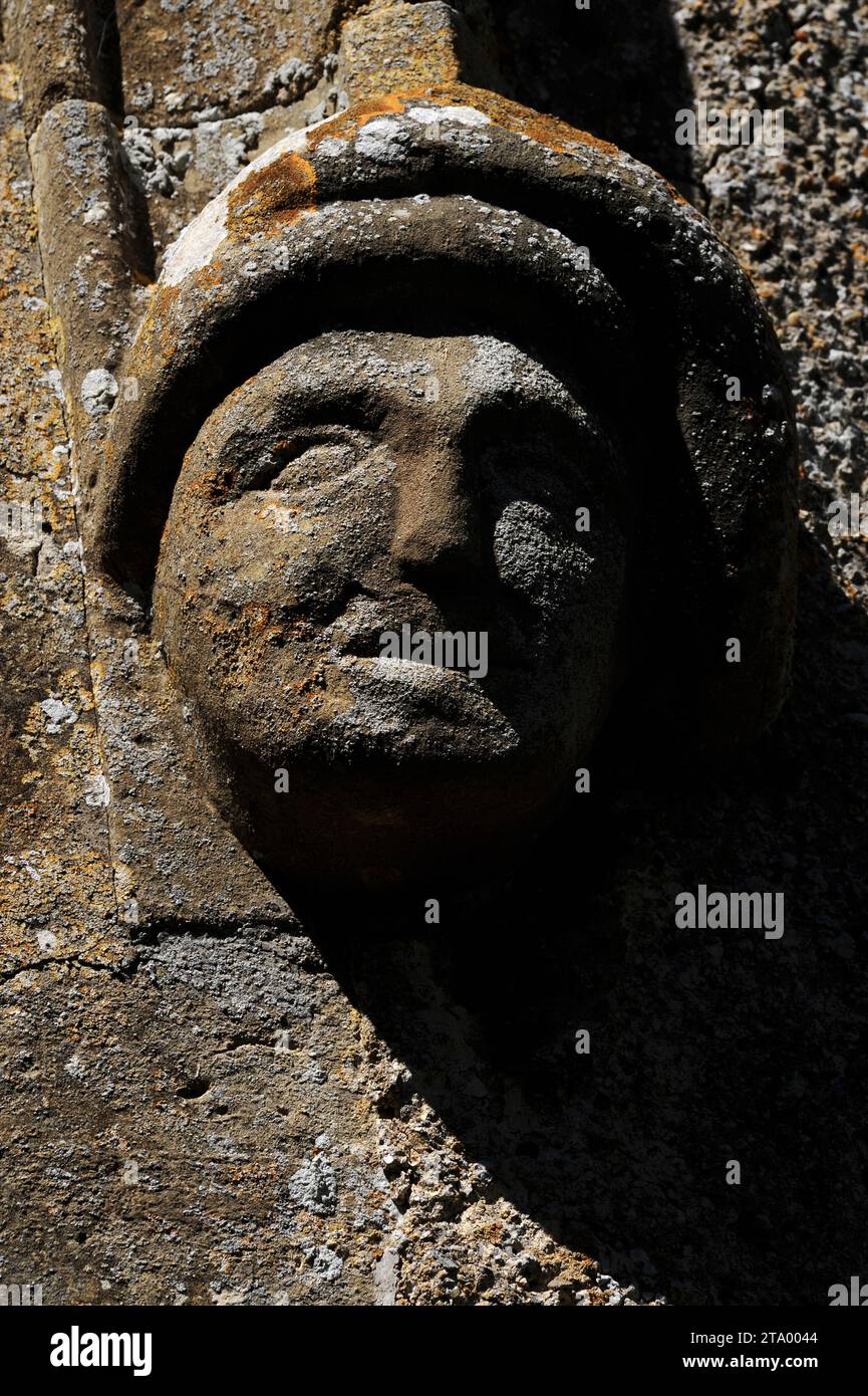 Sculpted male head stop at end of dripstone over Perpendicular Gothic ...