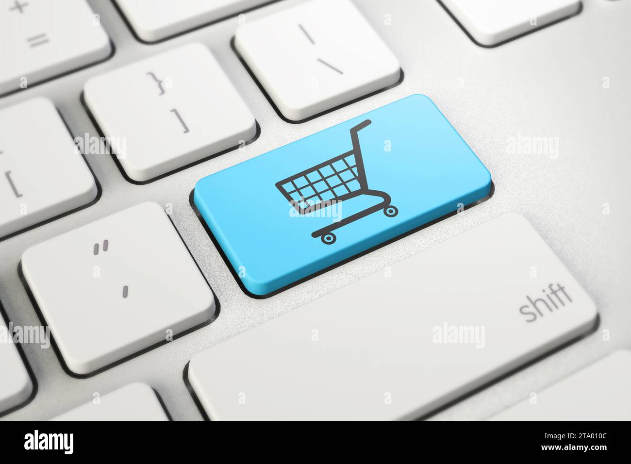 shopping cart symbol on blue button key of white keyboard, online ...
