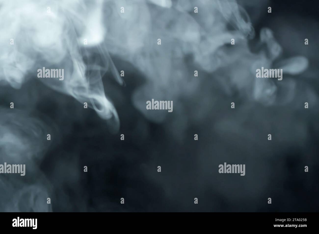 smoke slowly floating through space against black background Stock ...